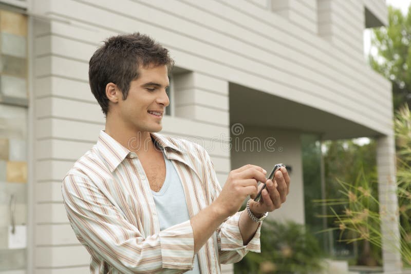 Home Tech Man Using a Cell Phone in Office Garden Stock Image - Image ...