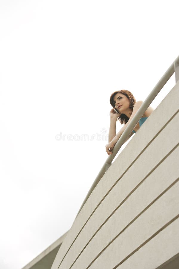 Home Tech Woman Using Cell on Balcony Stock Photo - Image of graphic ...