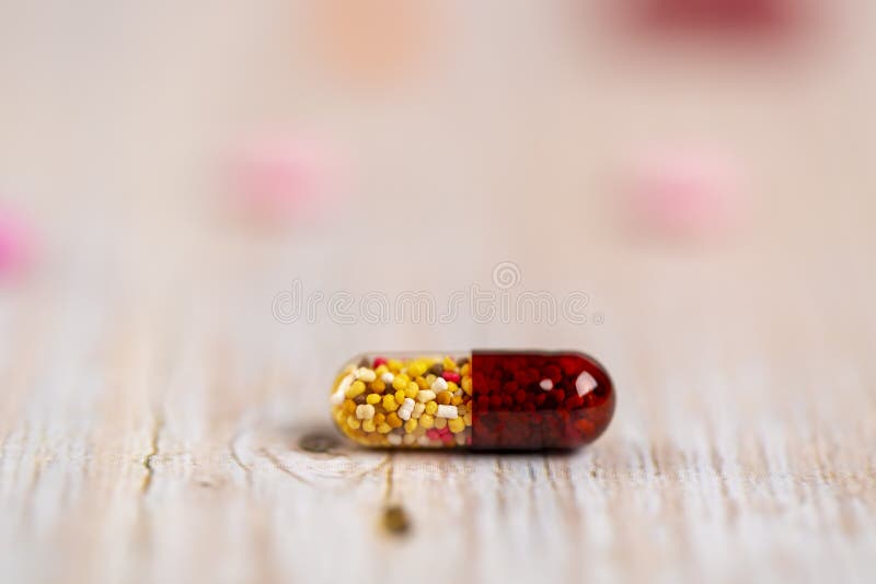 Home Therapy. One Red Clear Capsule of Microgranules Stock Image ...