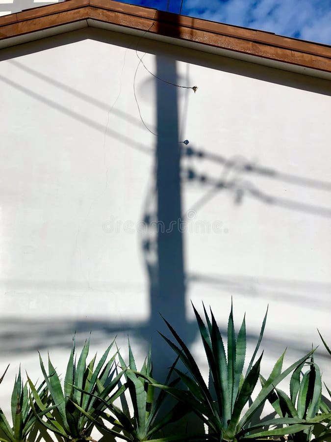 The Shadow of the Electric Pole in the Background of the Sun Stock ...