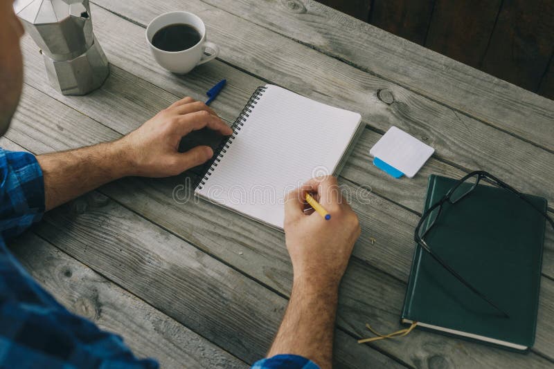 Home Workplace. Male Hands Write Notebook on Wooden Table Stock Photo ...