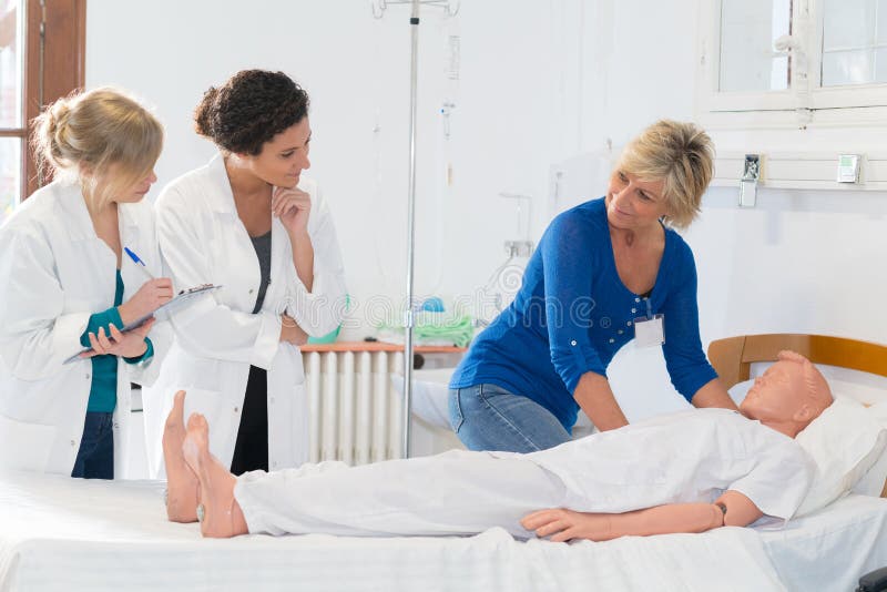 Homecare Nurses Learning To Use Hoist Stock Photo - Image of male ...