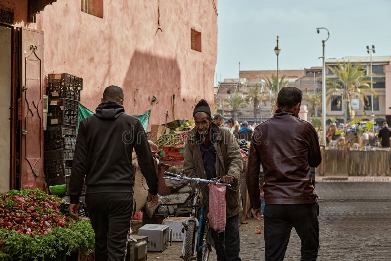 Homeless Man with a Bicycle Wandering through the Streets of Marrakech ...