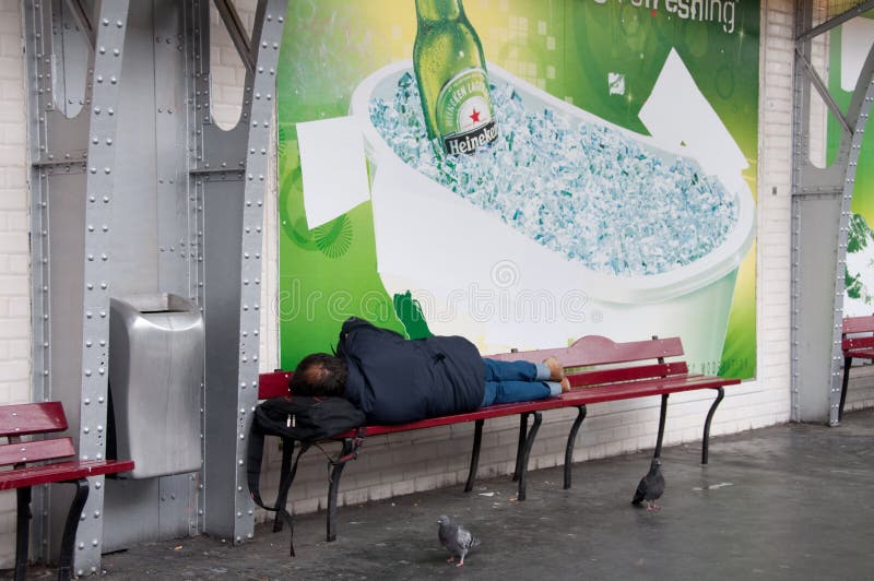 Homeless Man Sleeping Under Metro Ad Editorial Photography - Image of ...