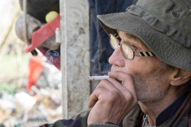 Homeless man smoking stock photo. Image of caucasian - 69401902