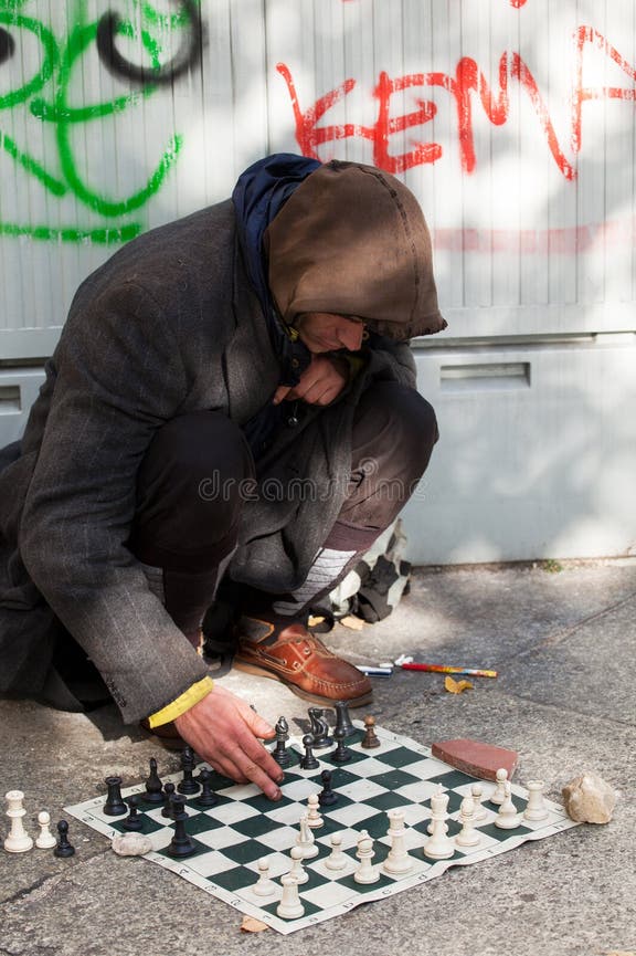 Homeless Men playing chess stock photo. Image of looking - 16669466