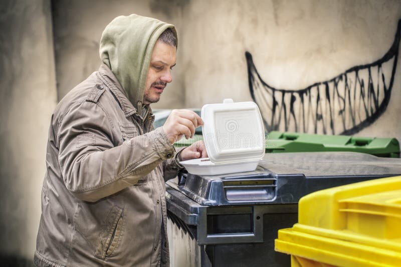 A Homeless Man Near the Ruins Sleeps on Cardboard Boxes, Helping Poor ...