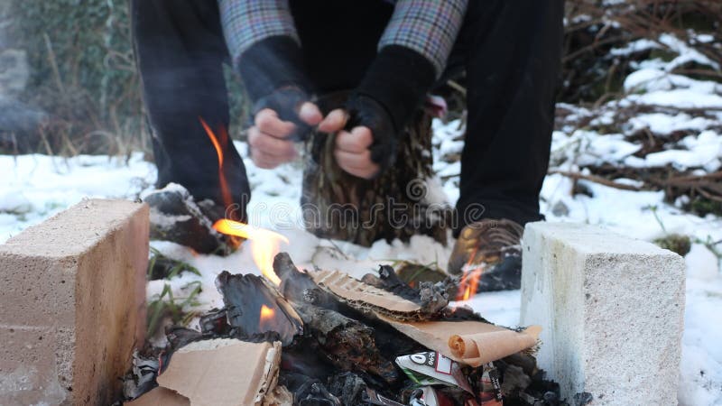 A Homeless Warms His Hands Over an Outdoor Fireplace Stock Footage ...