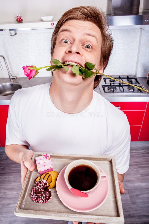 Homem com a flor na boca imagem de stock. Imagem de flores - 34923659