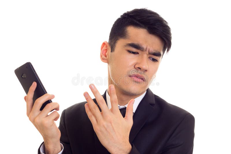 Homem Novo No Terno Que Fala No Telefone Foto de Stock - Imagem de ... Homem Novo No Terno Que Fala No Telefone Foto de Stock - Imagem de ...