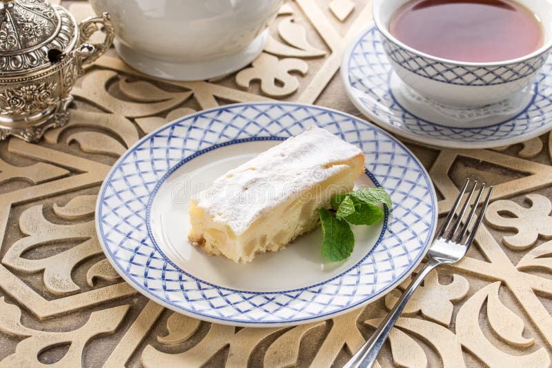 Homemade Apple Sponge Cake with Cup of Black Tea on Oriental Wooden ... Homemade Apple Sponge Cake with Cup of Black Tea on Oriental Wooden ...