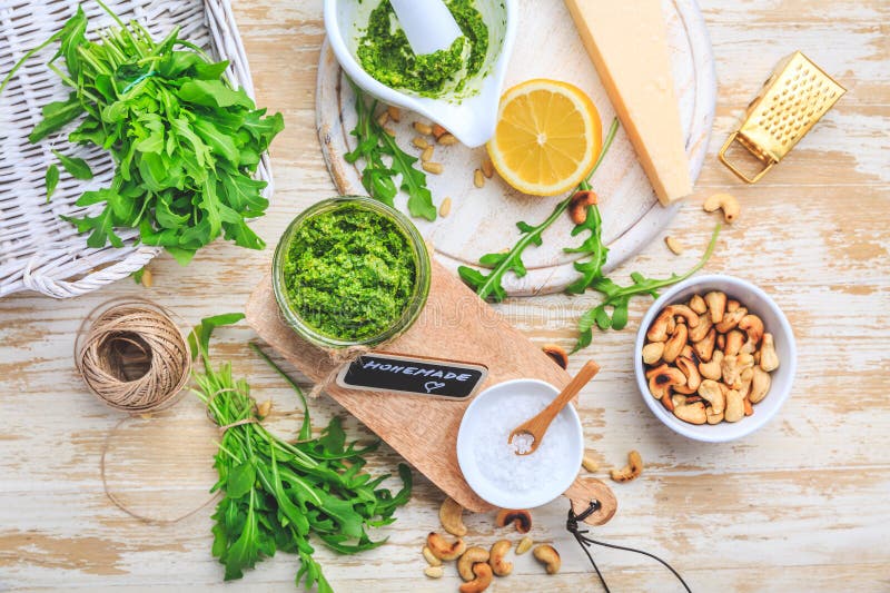 Homemade Arugula Pesto with Lemon, Nuts and Parmesan Cheese Stock Photo ...