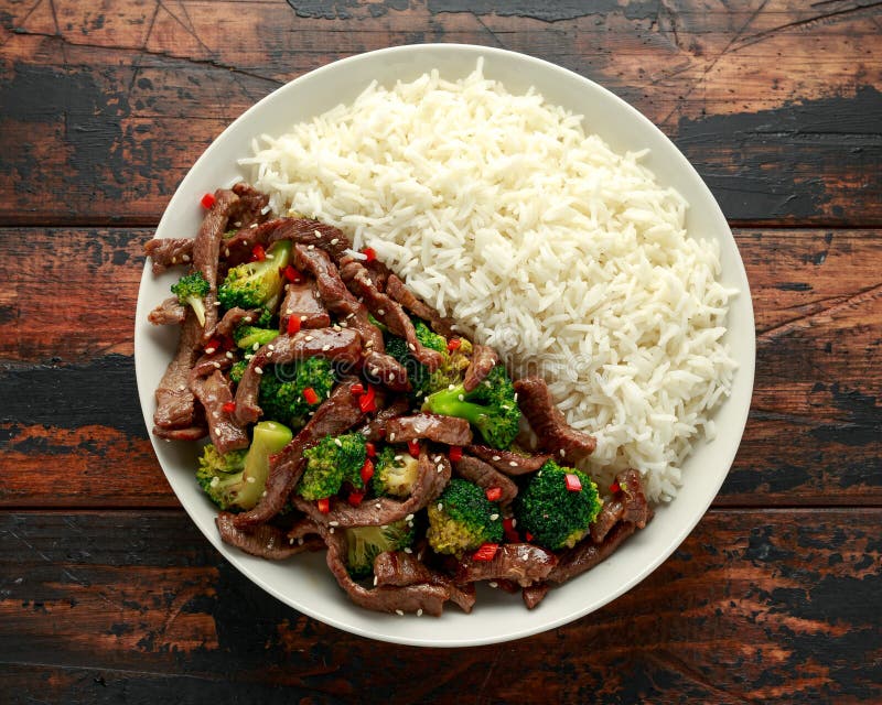 Homemade Beef and Broccoli with Rice on Wooden Table Stock Image ...