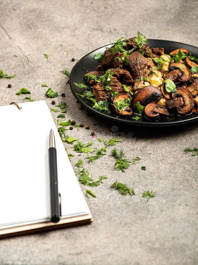 Homemade Beef Stew with Mushrooms and a Side Dish of Lentils on a Black ...