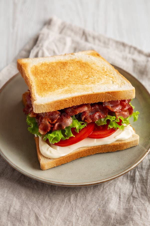 Homemade BLT Sandwich (Bacon, Lettuce and Tomato) on a Plate, Side View ...