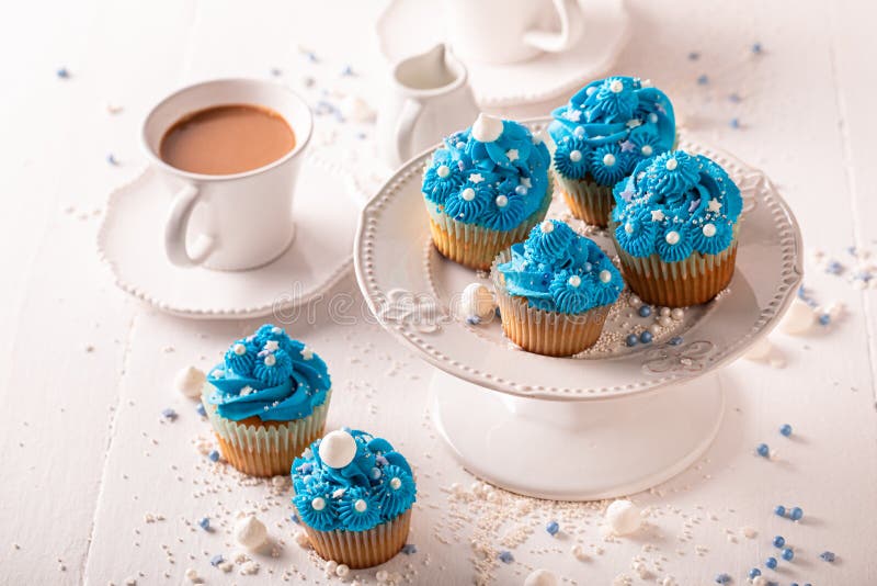 Homemade Blue Cupcakes with Flower Shaped Cream Stock Photo - Image of ...