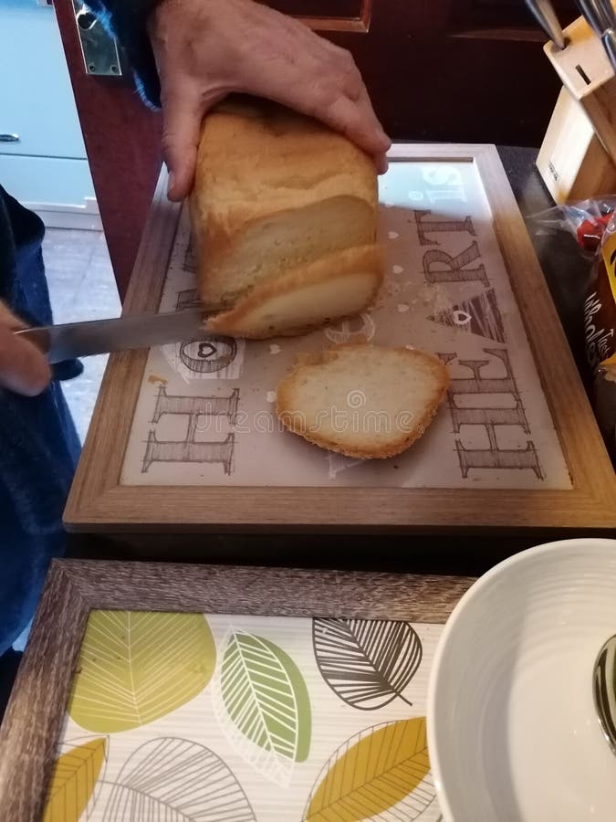 Homemade Bread Being Sliced Stock Photo - Image of lunch, meal: 181815538