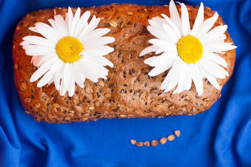 Homemade Bread with Cereals and Chamomille Smile Face on a Blue ...