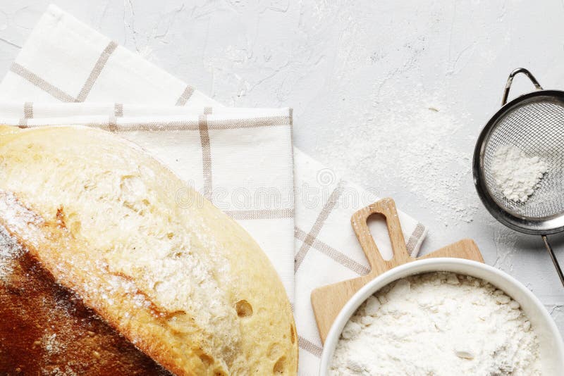 Homemade Bread Loaf, Kitchen Utensils and Ingredients on a Light Table ...