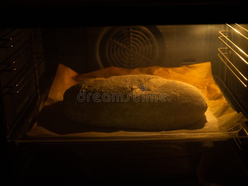 Homemade bread in the oven stock photo. Image of homemade - 185169626