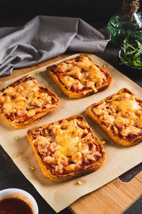Homemade Bread Pizza with Bacon and Cheese on a Board on the Table ...