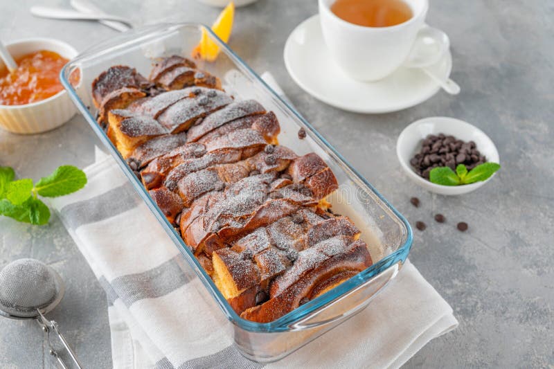 Homemade Bread Pudding with Chocolate Chips on a Gray Concrete ...