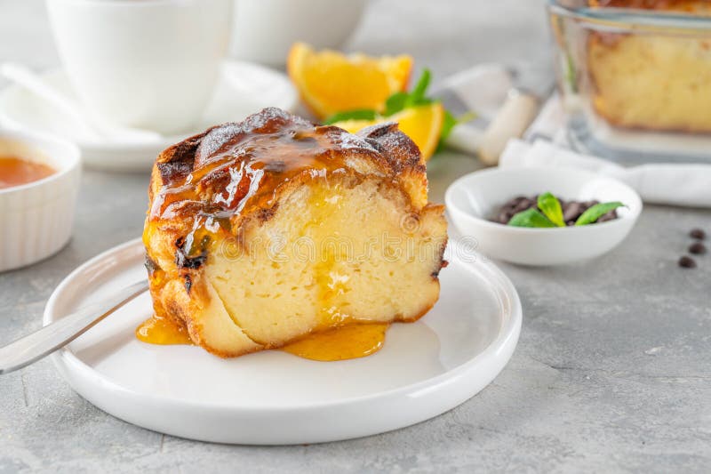 Homemade Bread Pudding with Chocolate Chips on a Gray Concrete ...