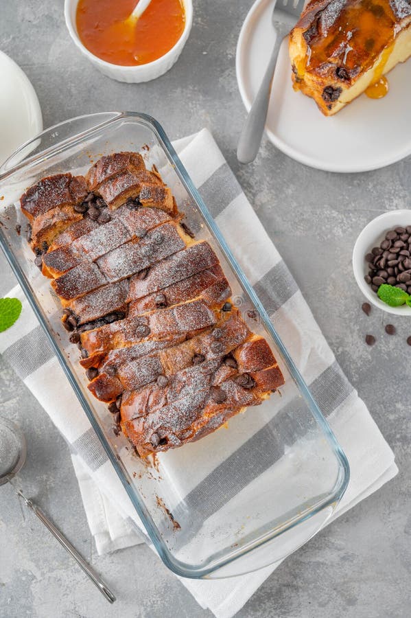 Homemade Bread Pudding with Chocolate Chips on a Gray Concrete ...