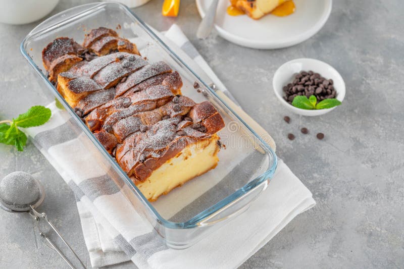 Homemade Bread Pudding with Chocolate Chips on a Gray Concrete ...