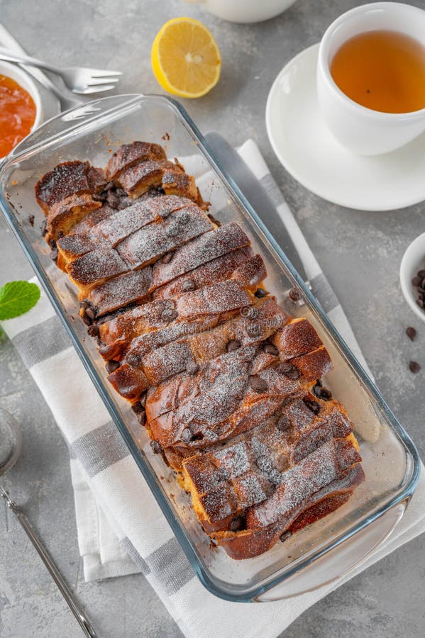 Homemade Bread Pudding with Chocolate Chips on a Gray Concrete ...
