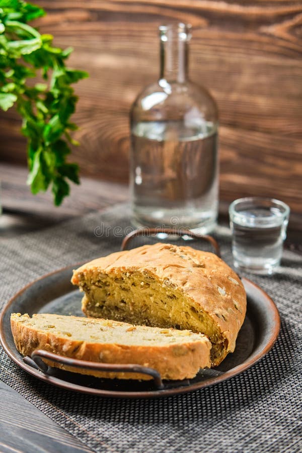 Homemade Bread with Pumpkin Seeds and Frozen Vodka on Rustic Background ...