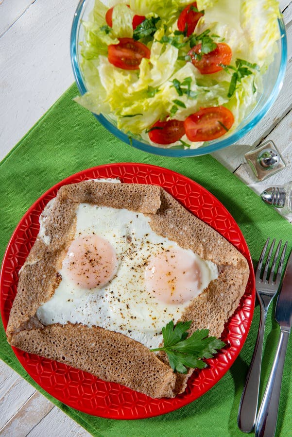 Homemade Breton Crepe with Egg in Red Plate Stock Photo - Image of ...