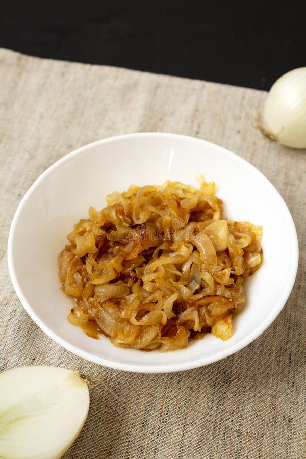 Homemade Caramelized Onions on a White Plate on a Black Surface, Side ...