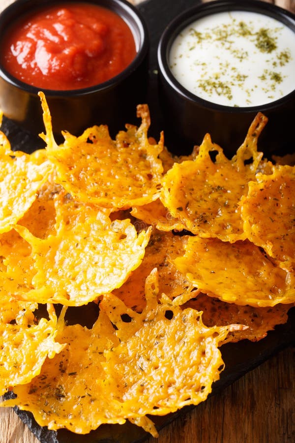 Homemade Cheddar Chips with Herbs Served with Sauces Close-up. Vertical ...