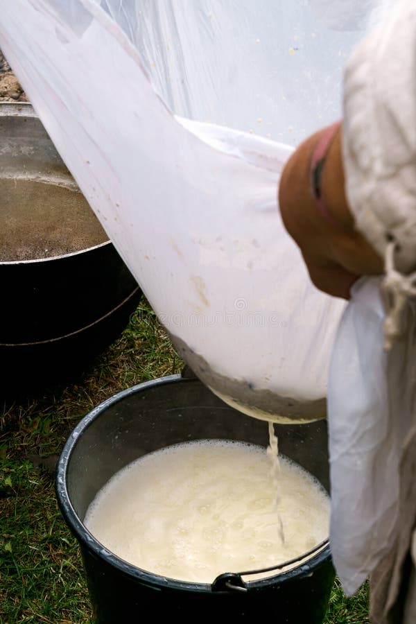 Homemade Cheese Production in a Large Cauldron Over a Fire Stock Image ...