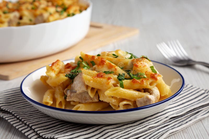 Homemade Cheesy Chicken Alfredo Pasta Bake on a Plate, Side View Stock ...