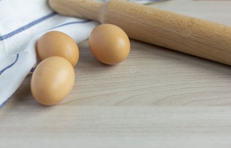 Homemade Chicken Eggs and a Rolling Pin on the Table.Preparation for ...