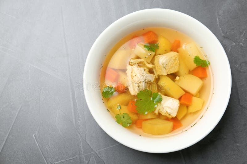 Homemade Chicken Soup In Dish On Grey Background, Top View Stock Photo ...