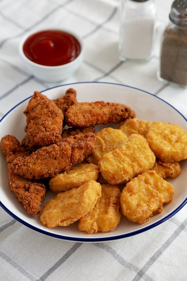 Homemade Chicken Strips and Nuggets with Ketchup Stock Photo - Image of ...