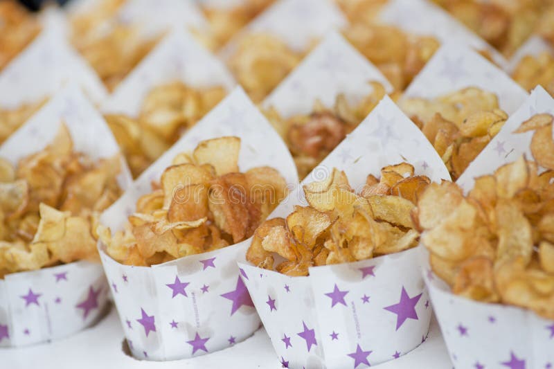 Homemade Chips in Paper Package Stock Photo - Image of ripple, salted ...