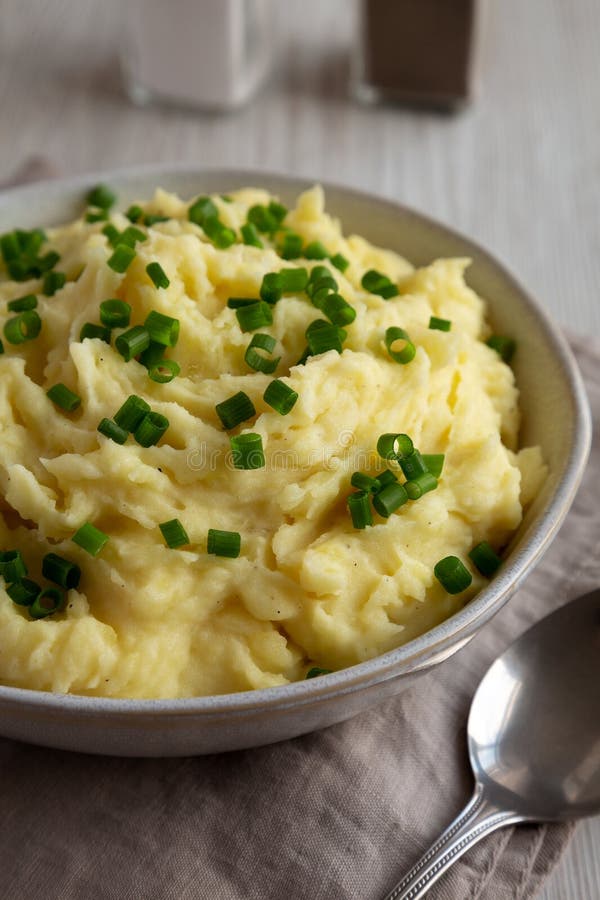 Homemade Chive and Garlic Mashed Potatoes in a Bowl, Side View. Close ...