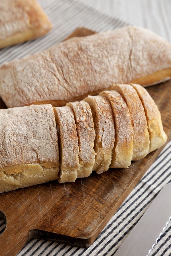 Homemade Ciabatta Bread on a Wooden Board, Side View Stock Photo ...
