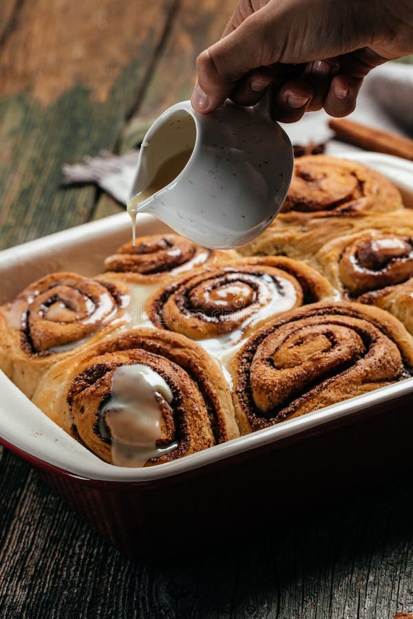Homemade Cinnamon Baking, Cinnamon Rolls with Vanilla Cream. Vertical ...