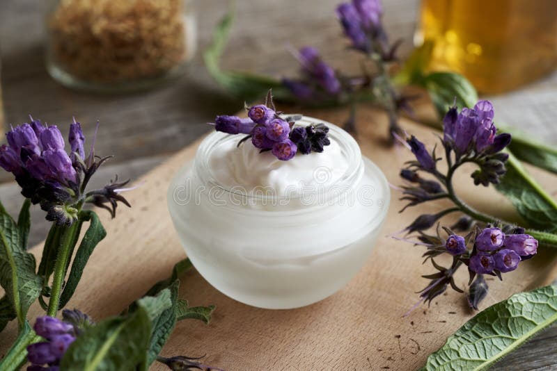 Homemade Comfrey Root Ointment with Blooming Plant Stock Photo - Image ...