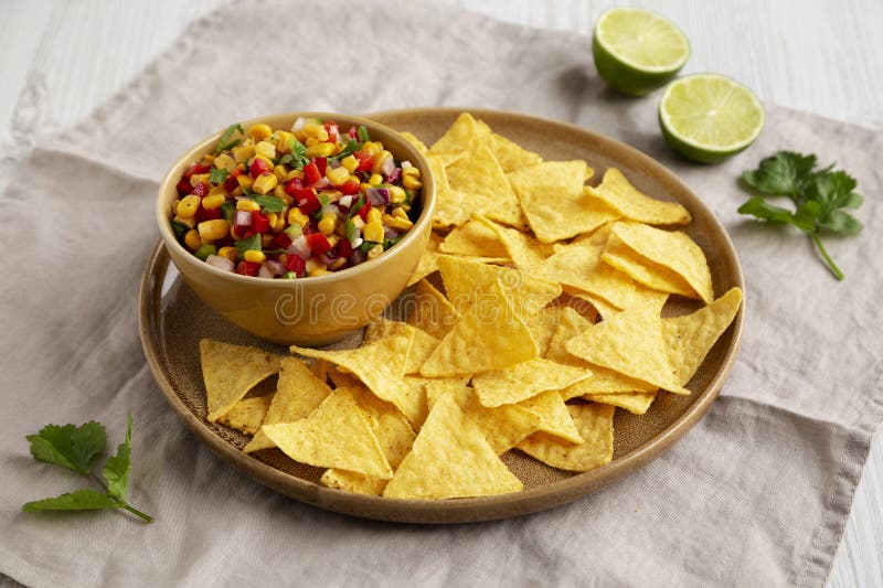Homemade Corn Salsa with Tortilla Chips on a Plate, Side View Stock ...