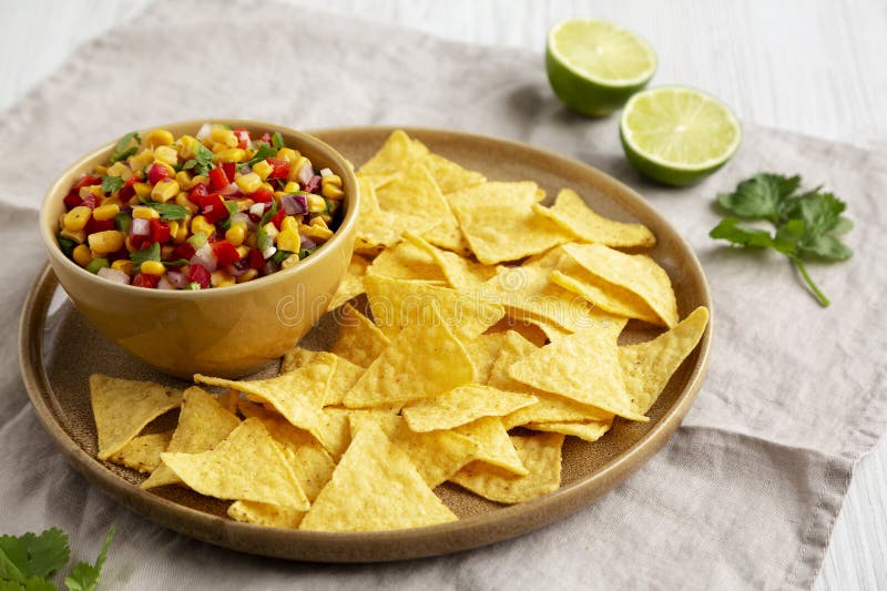 Homemade Corn Salsa with Tortilla Chips on a Plate, Side View Stock ...