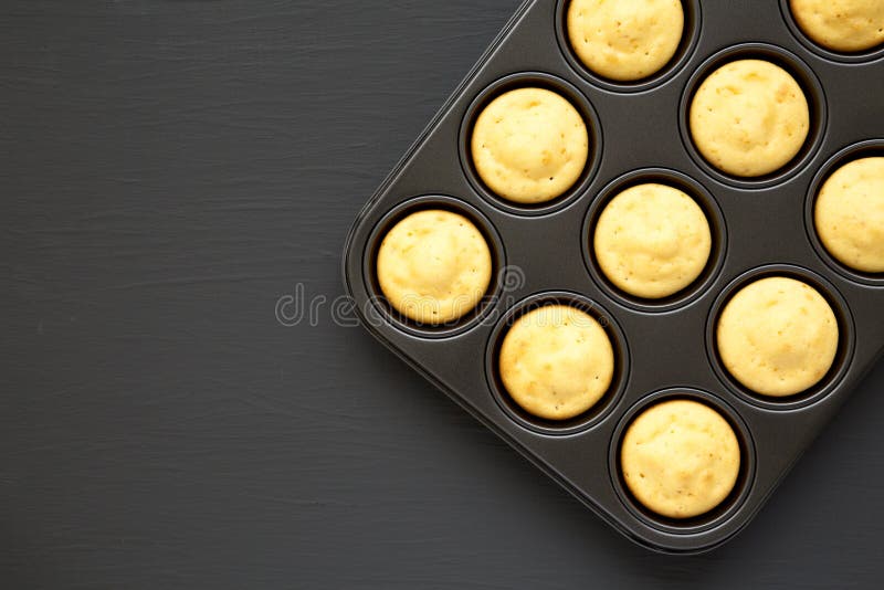 Homemade Cornbread Muffins on a Black Surface, Top View. Flat Lay ...