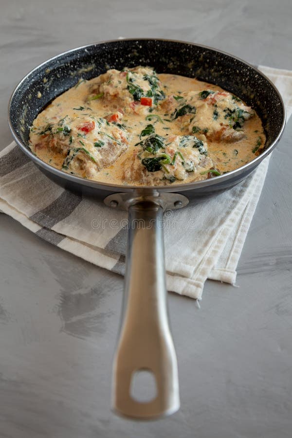 Homemade Creamy Tuscan Chicken with Spinach in a Pan, Low Angle View ...