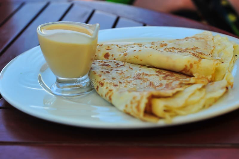 Homemade Crepes Folded in Triangles with Condensed Milk Stock Image ...