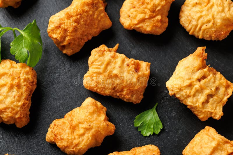 Homemade Crispy Fried Chicken Nuggets Served on a Stone Board Stock ...